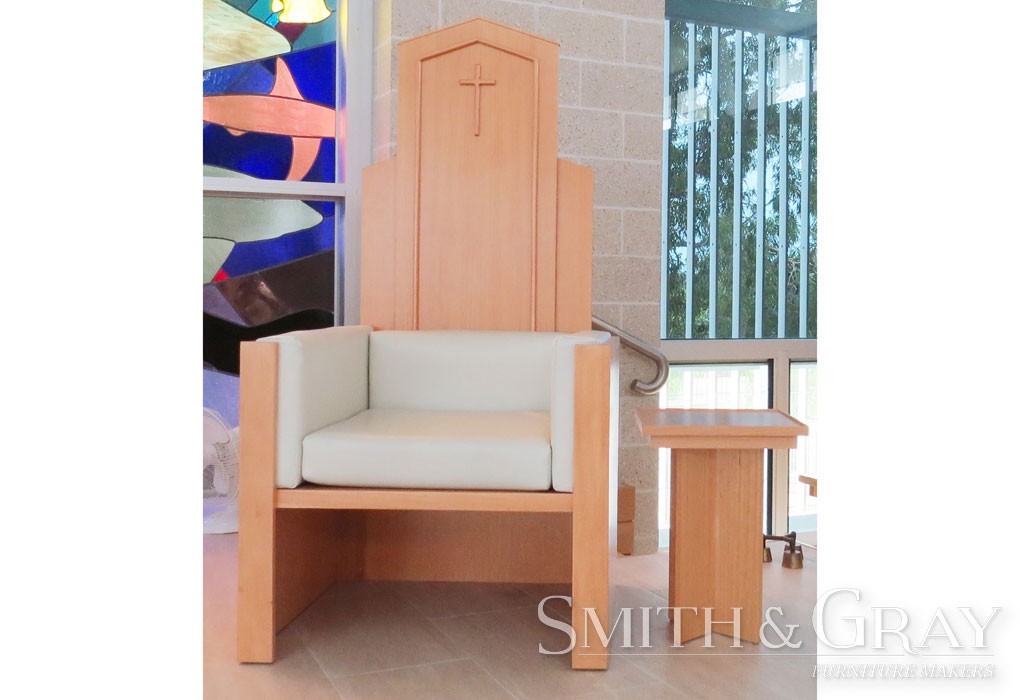 Upholstered Tasmanian Oak priests chair with carved crucifix and border ...